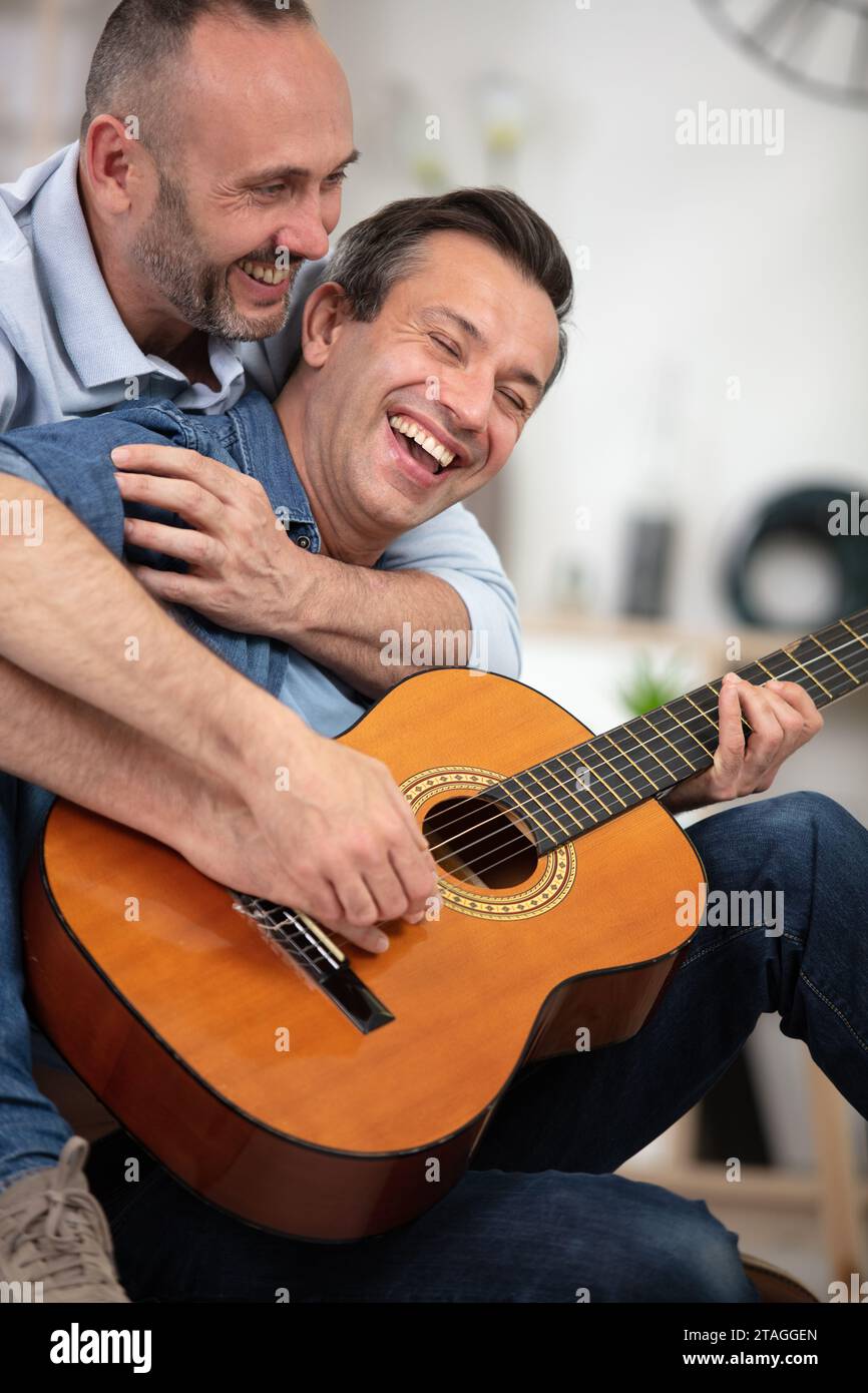 couple is having fun with guitars Stock Photo - Alamy