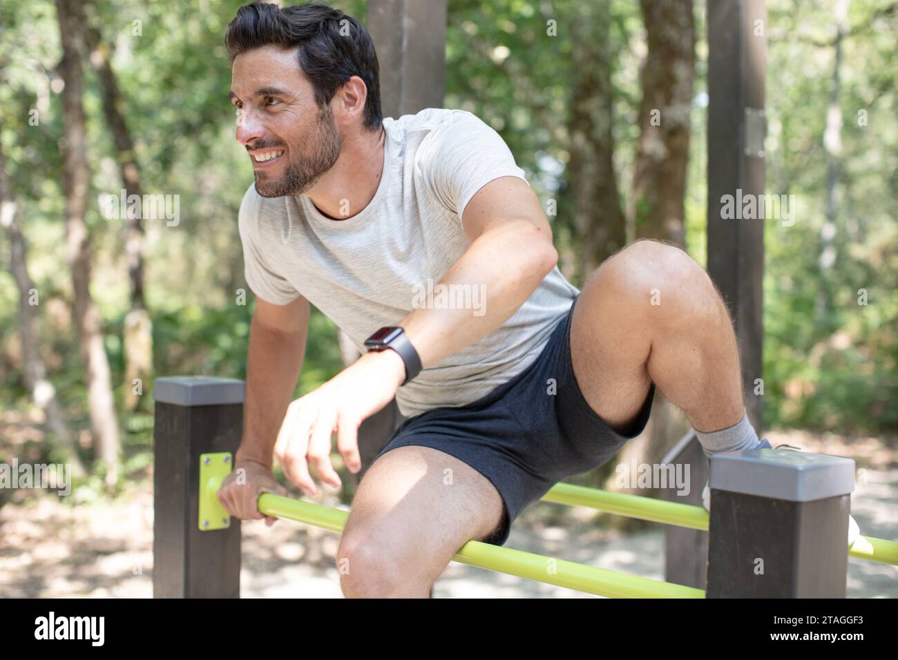 man vaulting hurdles in the park Stock Photo - Alamy