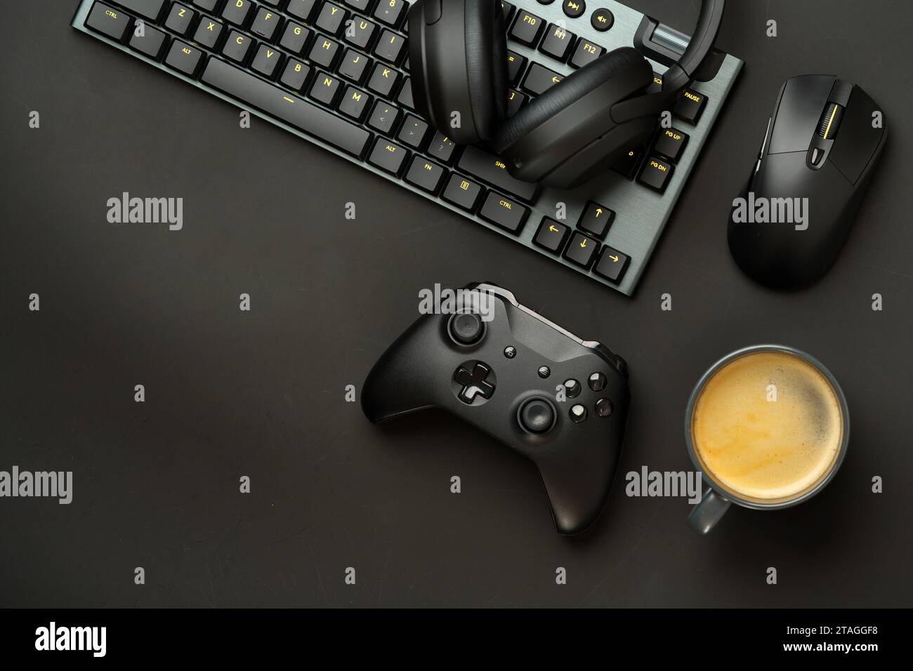 Gaming concept on black background with computer keyboard and joystick ...