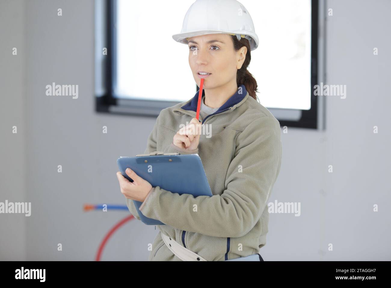 beautiful woman worker checking notes on clipboard Stock Photo - Alamy