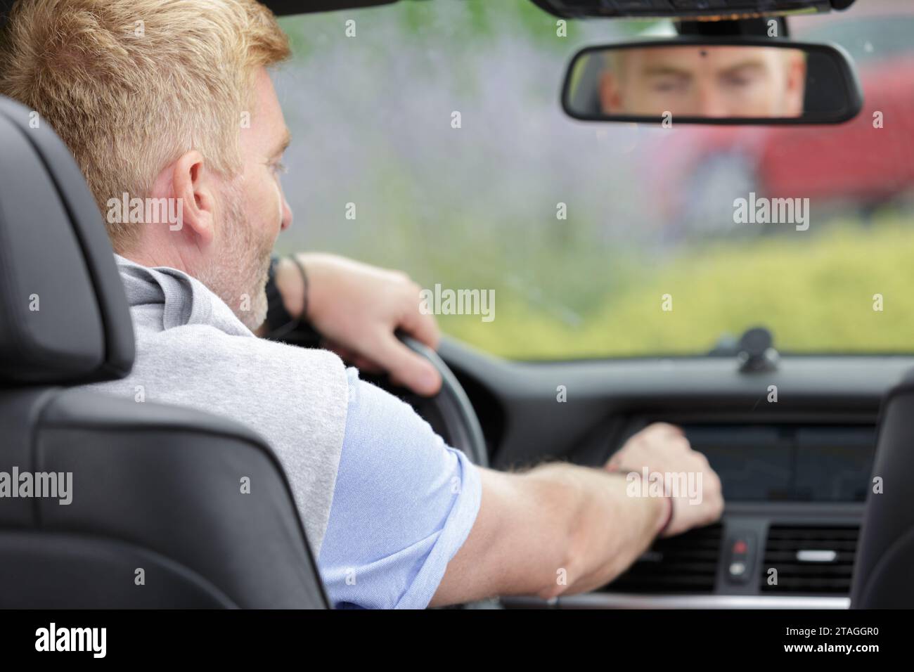 man driving a business car Stock Photo - Alamy