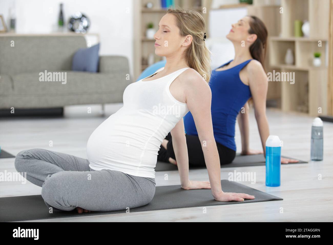 pregnant women gently stretching in antenatal exercise class Stock ...