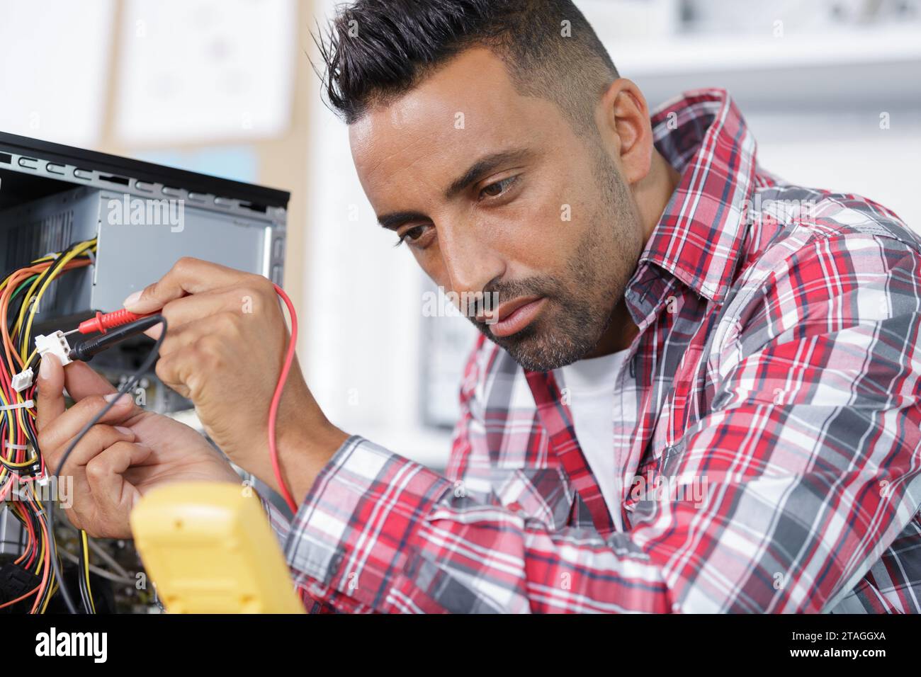 electrical engineer checking a pc Stock Photo - Alamy