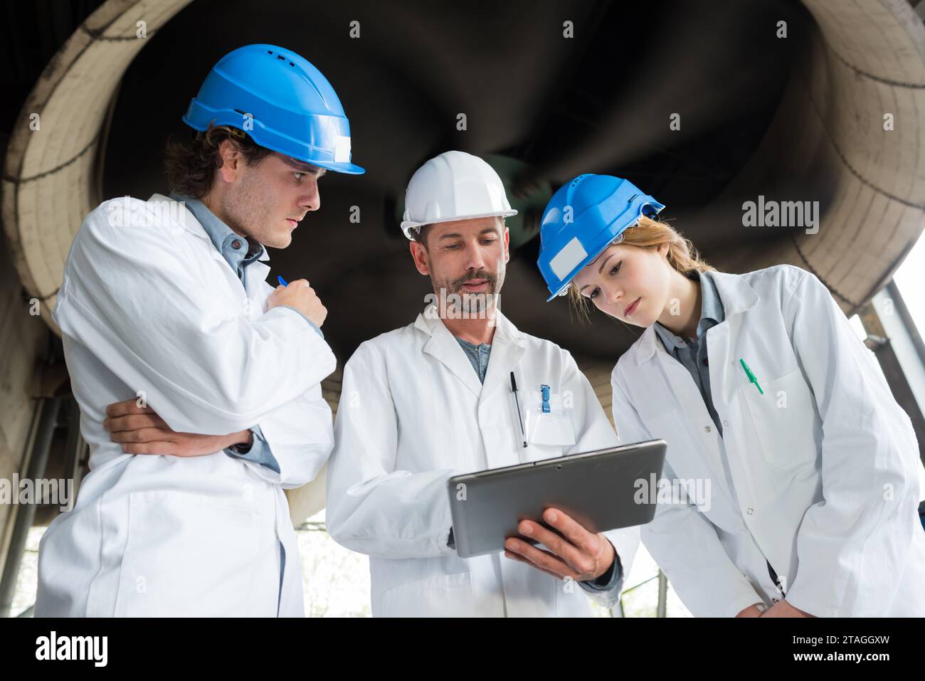 workers in a white labcoat in a nuclear power plant Stock Photo - Alamy