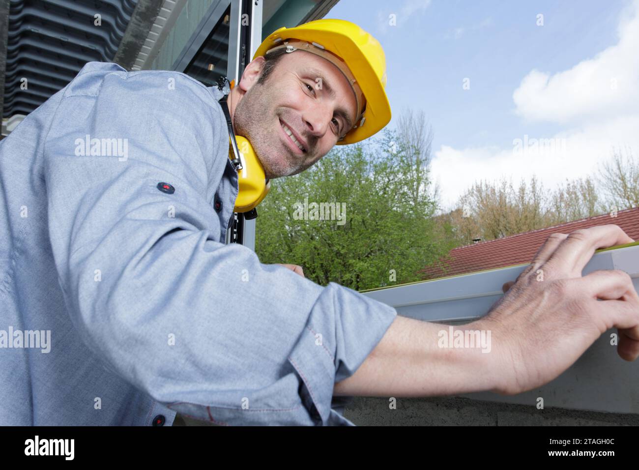 Installing window sill man hi-res stock photography and images - Alamy