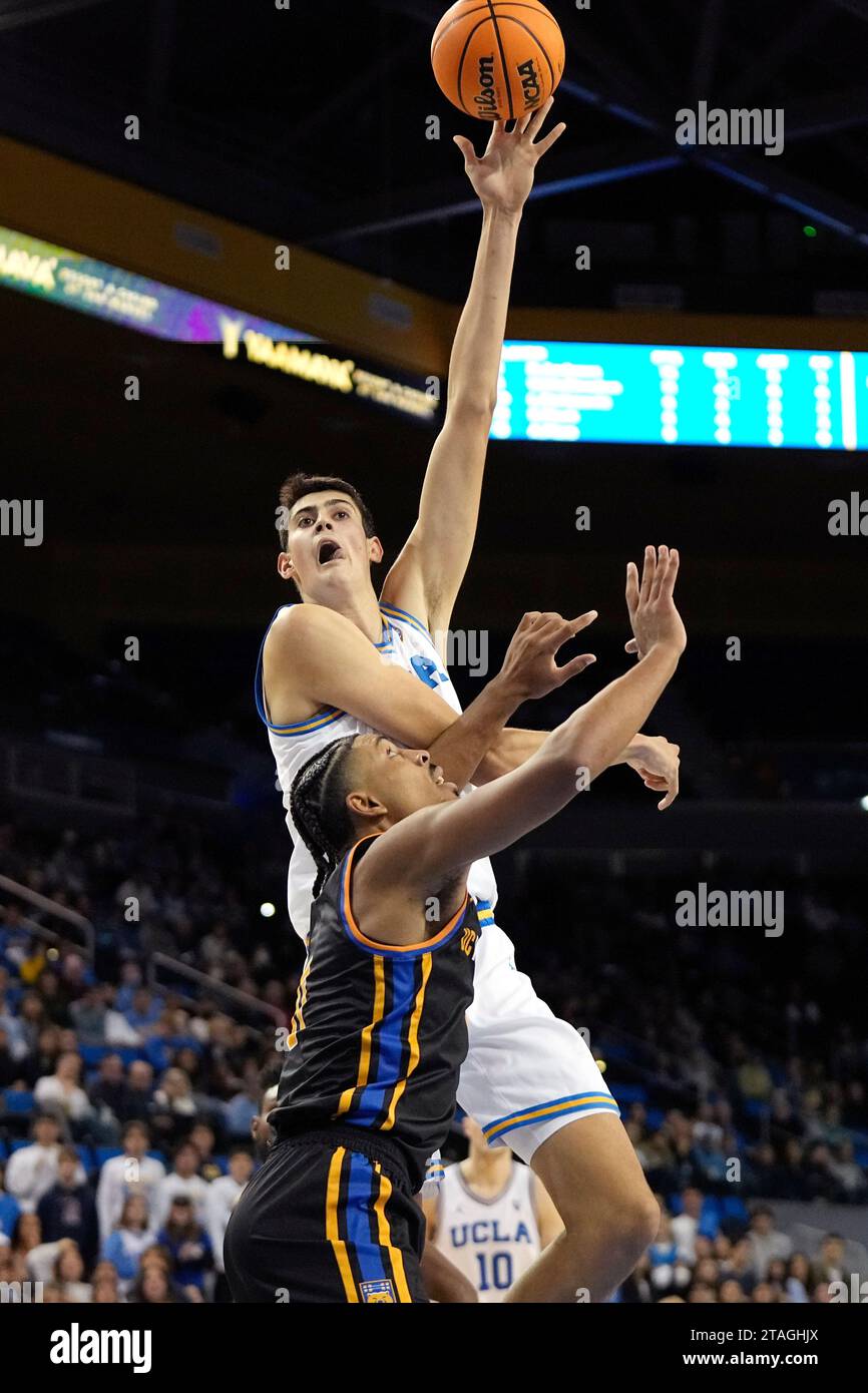 UCLA center Aday Mara, top, shoots as UC Riverside forward Kyle Owens ...