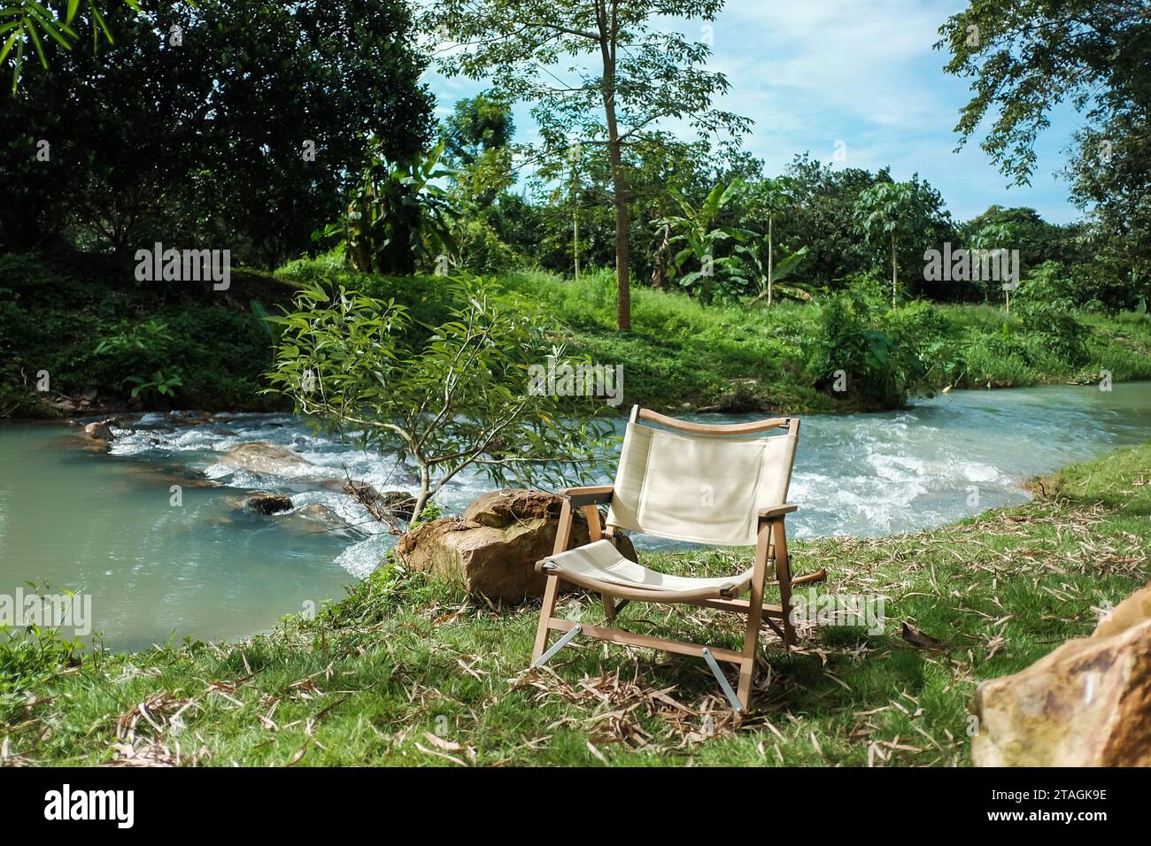 Camping and tent near river or lake. Wooden blank table top on camping ...