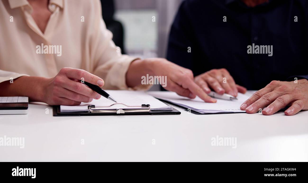 Corporate people reviewing documents hi-res stock photography and ...