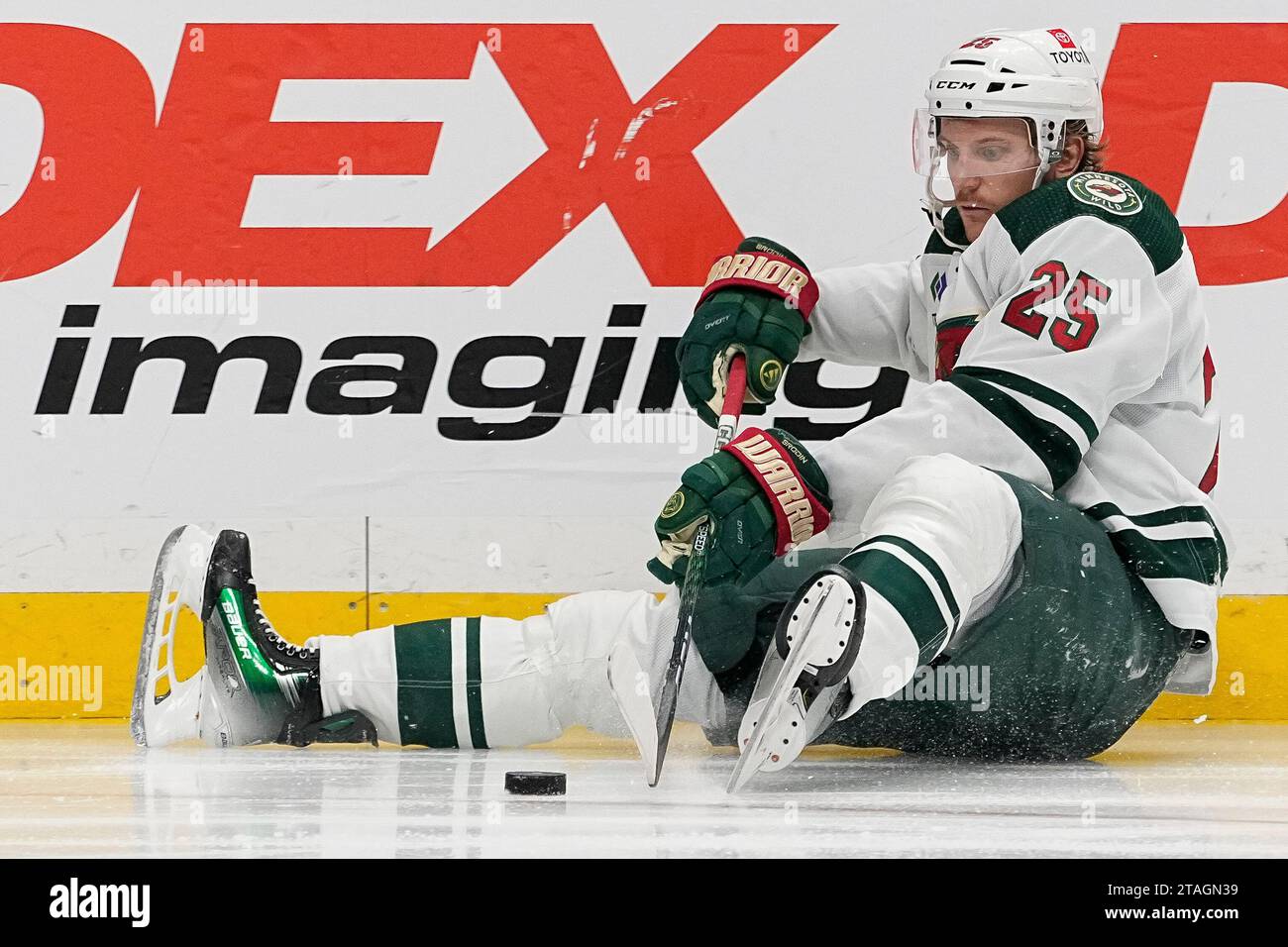 Minnesota Wild defenseman Jonas Brodin (25) slides across the ice ...