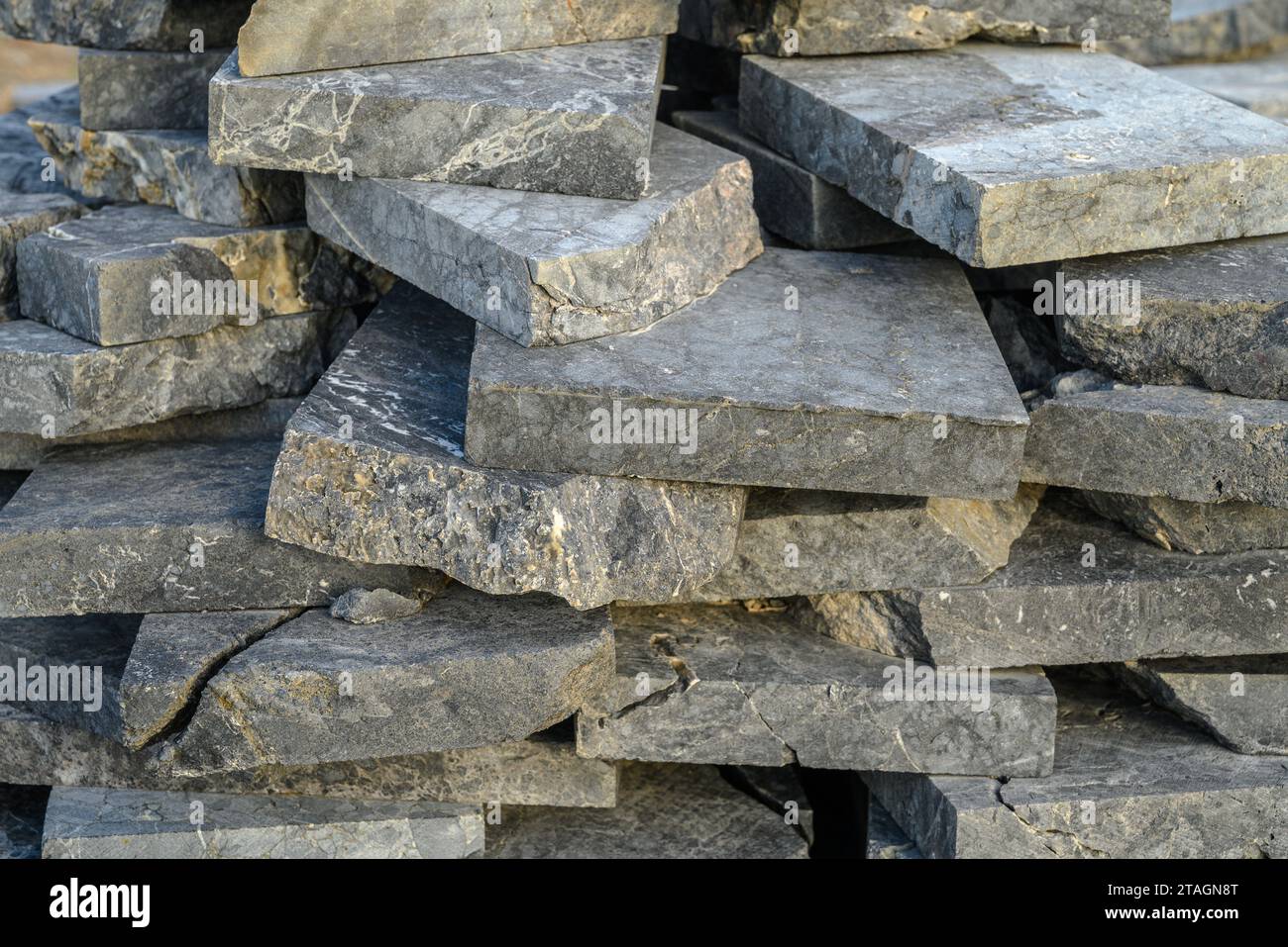 pieces of stone for paving lie in a heap as a background 1 Stock Photo ...