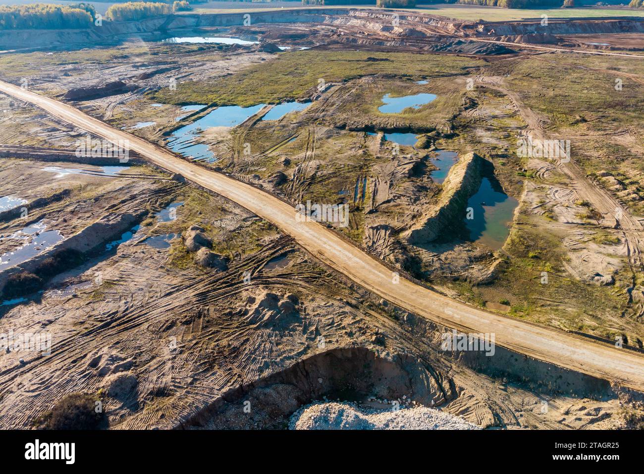 Road embankment for the passage of sand trucks in a sand quarry, view ...
