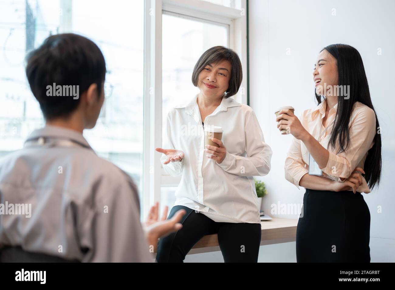 Group of happy diverse Asian businesspeople colleagues are enjoying ...