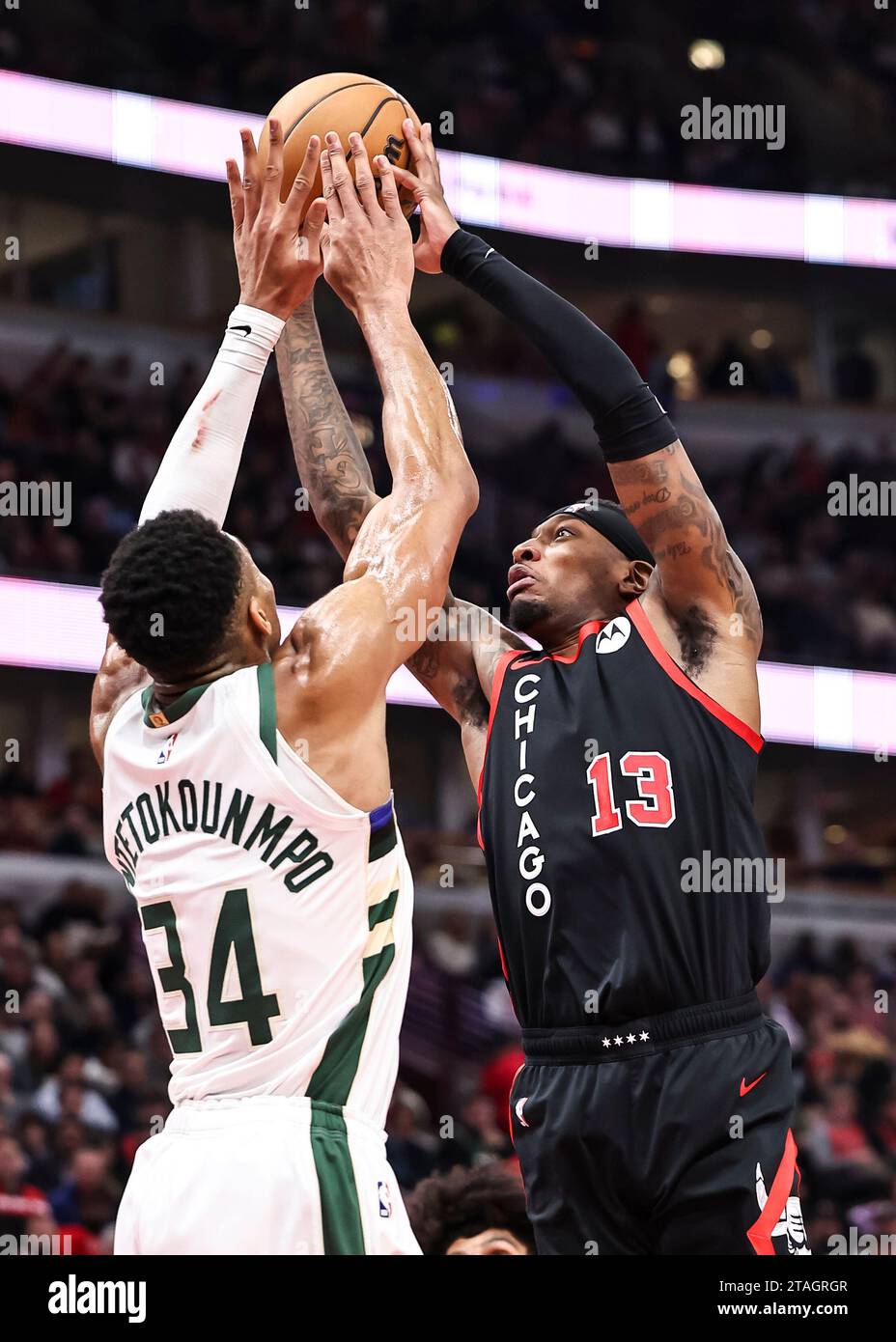 Chicago, United Stetes. 30th Nov, 2023. Torrey Craig (R) of Chicago ...