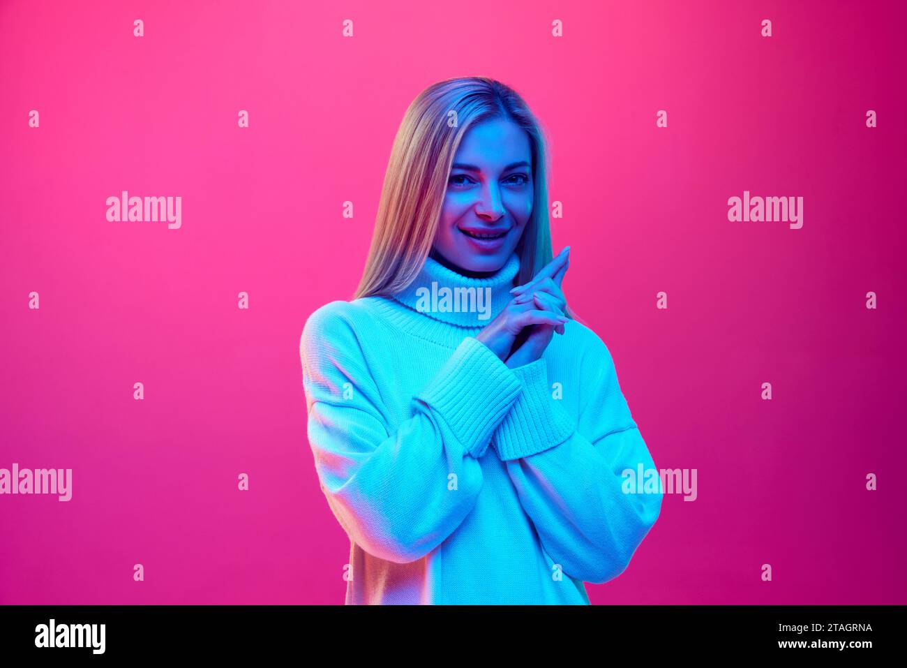 Beautiful young girl looking at camera with grin thinking something ...