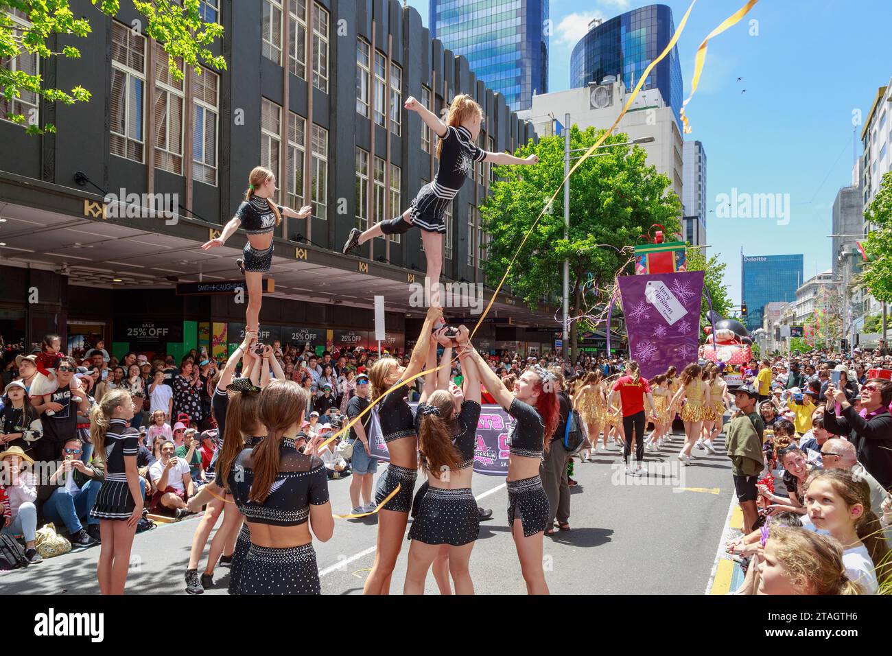 Cheerleaders performing acrobatics at the Farmers Christmas Parade on ...