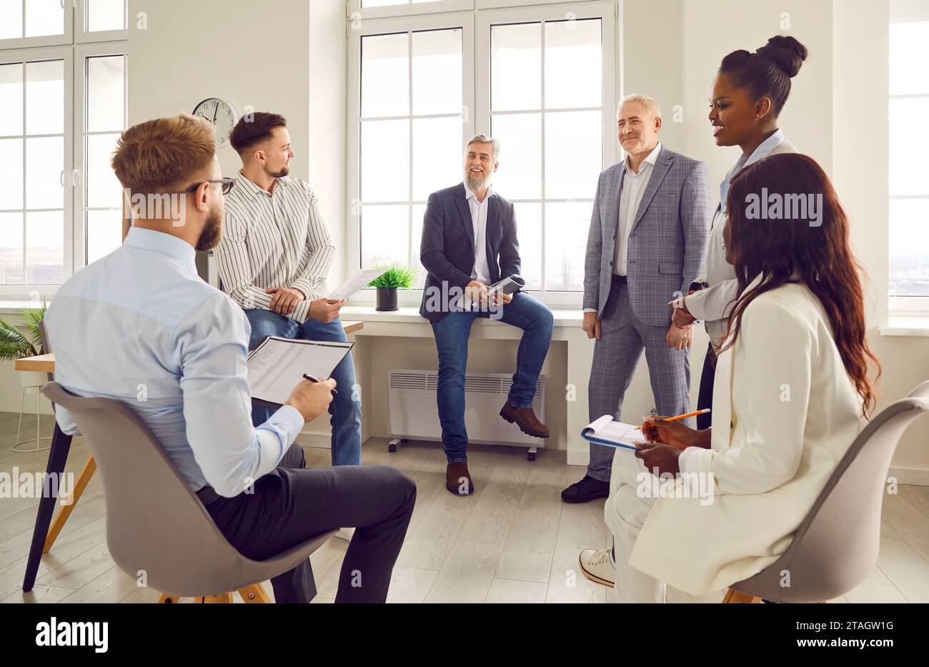 Group of business people talking on a meeting at the working place in ...