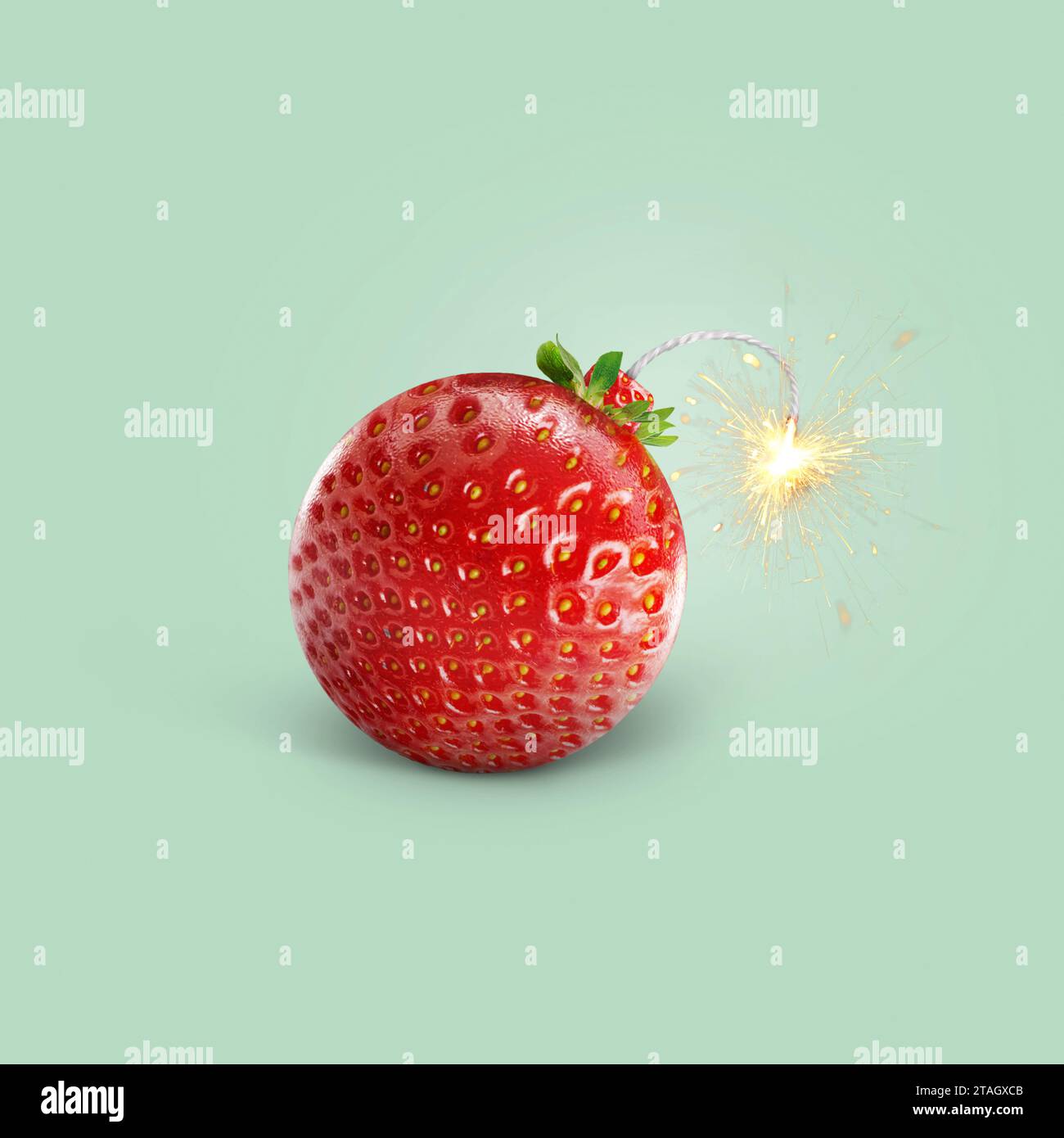 Creative juicy bomb strawberry with wick sparks on a colored green ...