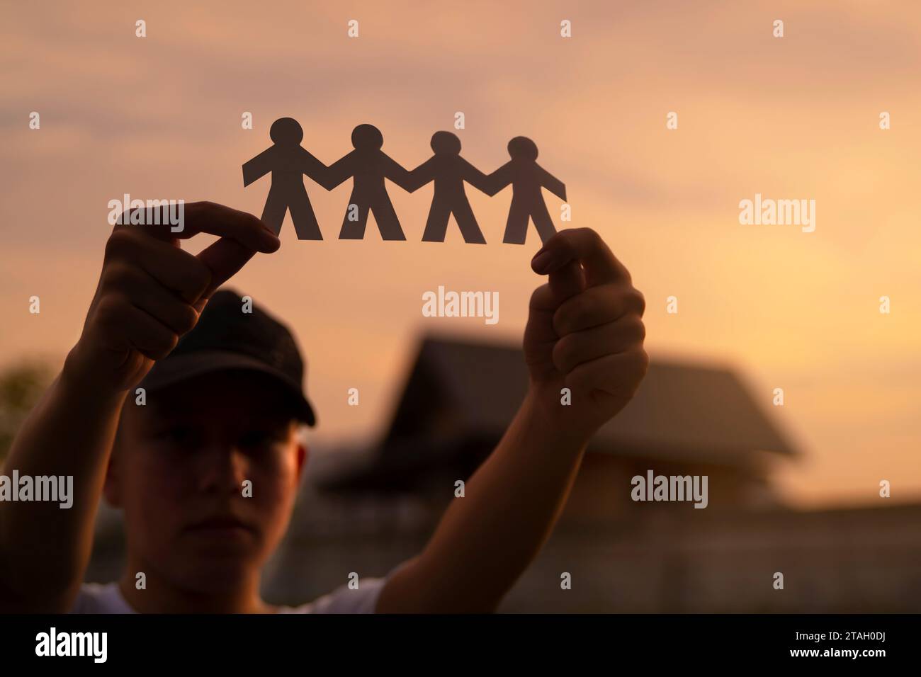 Teamwork and relations. symbolic of paper chains in teenage boy hand ...