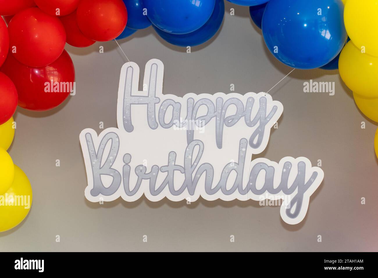 Happy birthday paper sign. Silver letters. Font. Surrounded by colorful ...