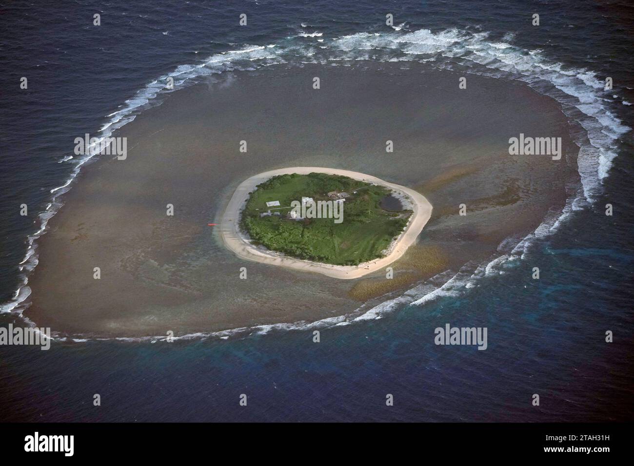 Waves surround the Philippine-occupied Nanshan Island, locally known as ...