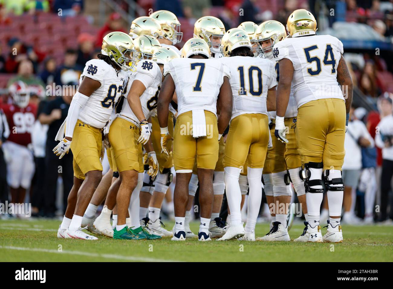 The Notre Dame Fighting Irish offensive unit in a group huddle during a ...