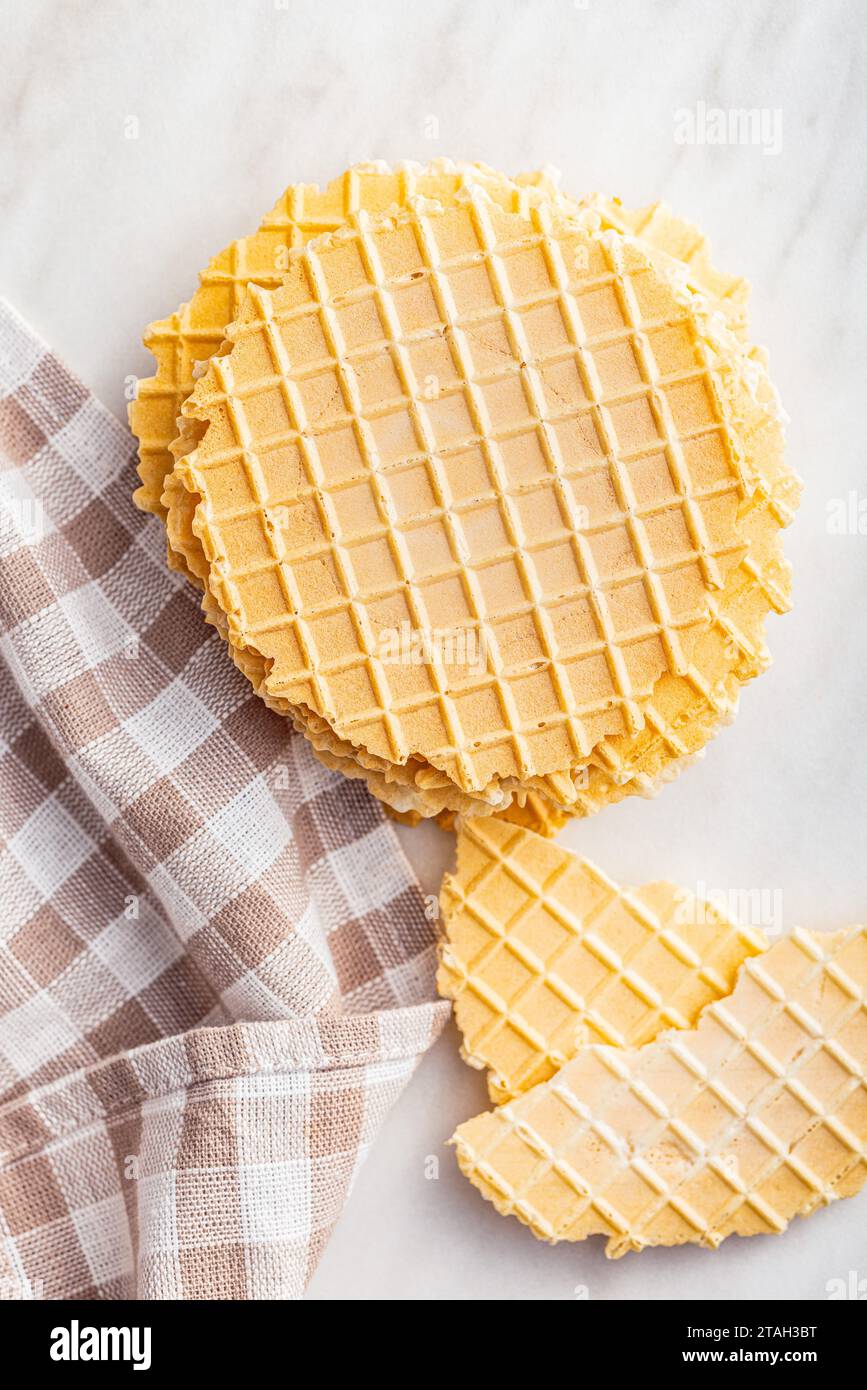 Round waffle biscuits on the kitchen table. Top view Stock Photo - Alamy