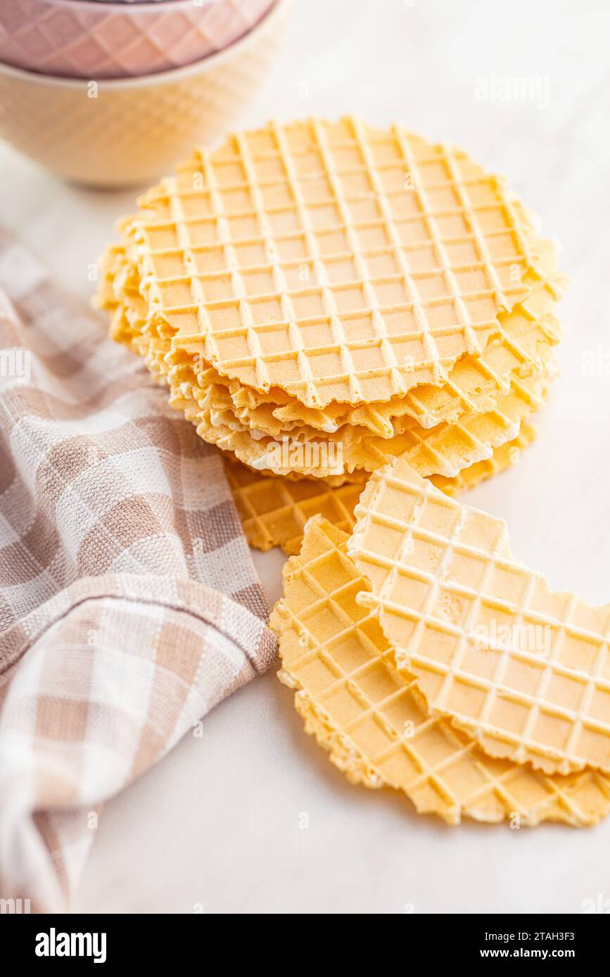 Round waffle biscuits on the kitchen table Stock Photo - Alamy