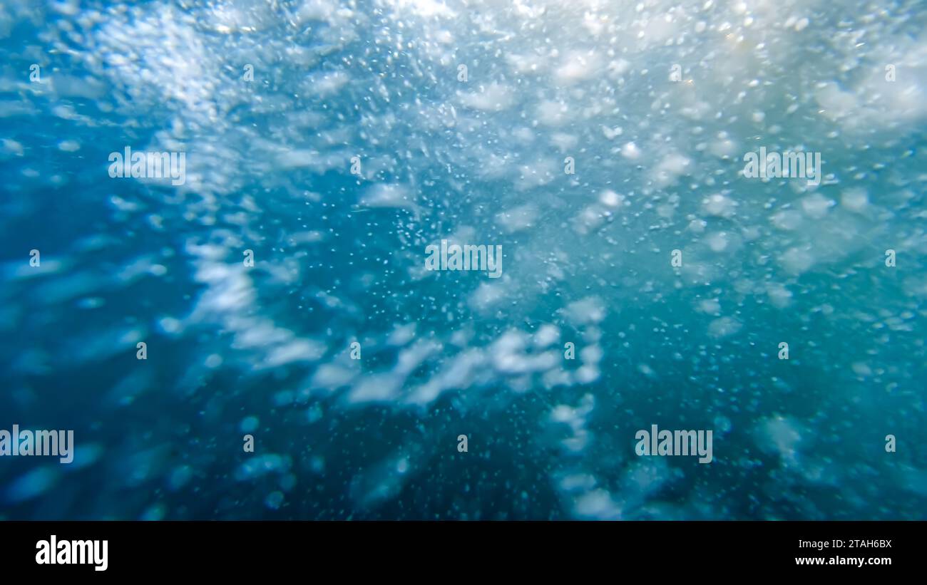 Fast river current with lots of air bubbles and vortexes shot ...