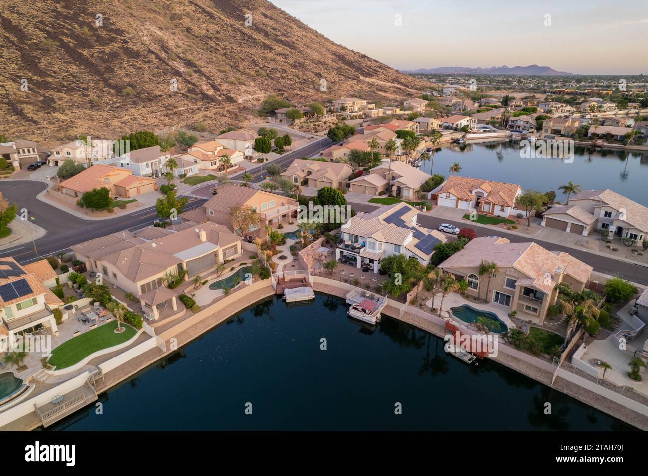 An aerial view of suburban houses near a mountain slope. Arrowhead ...