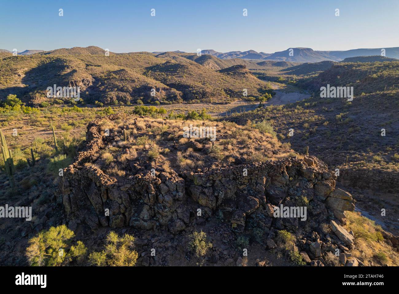 An aerial view of native American ruins overlooking the dry Agua Fria ...