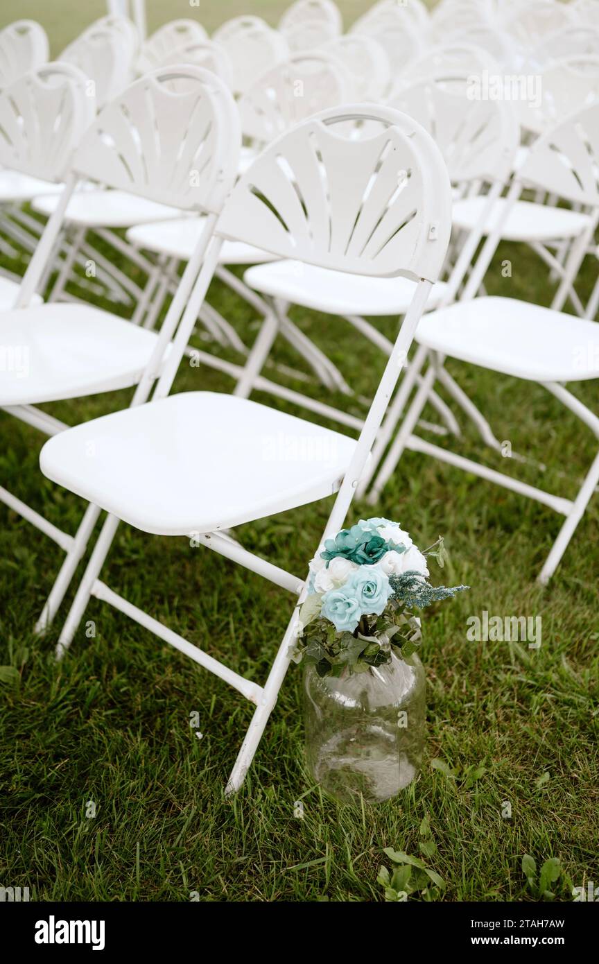 An outdoor setting with several chairs arranged in a circle, with a ...
