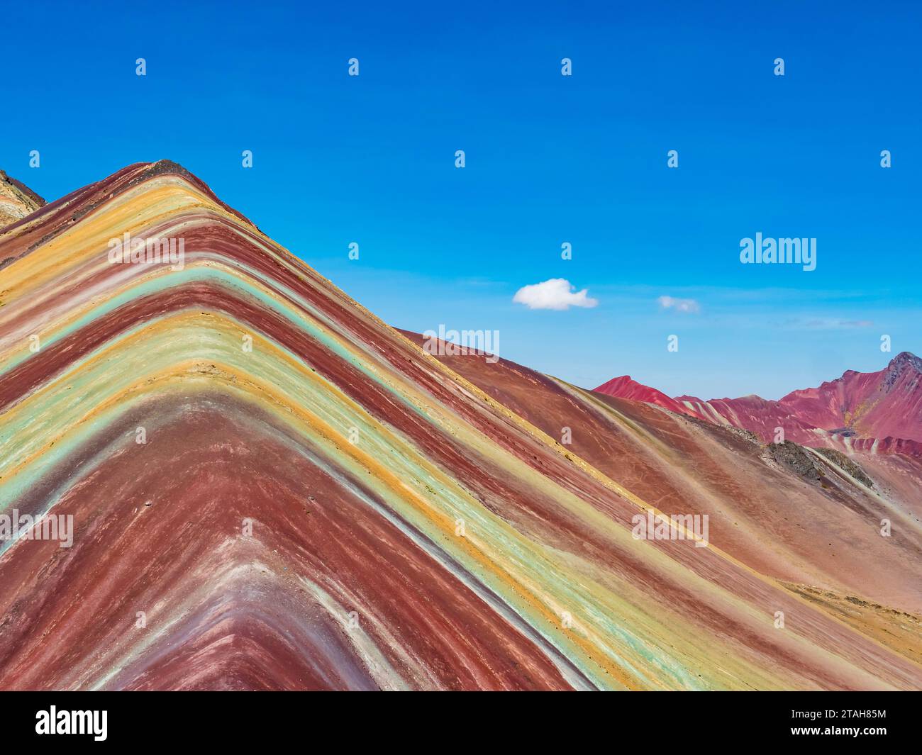 Spectacular view of the vivid colors of Vinicunca mountain on a bright ...