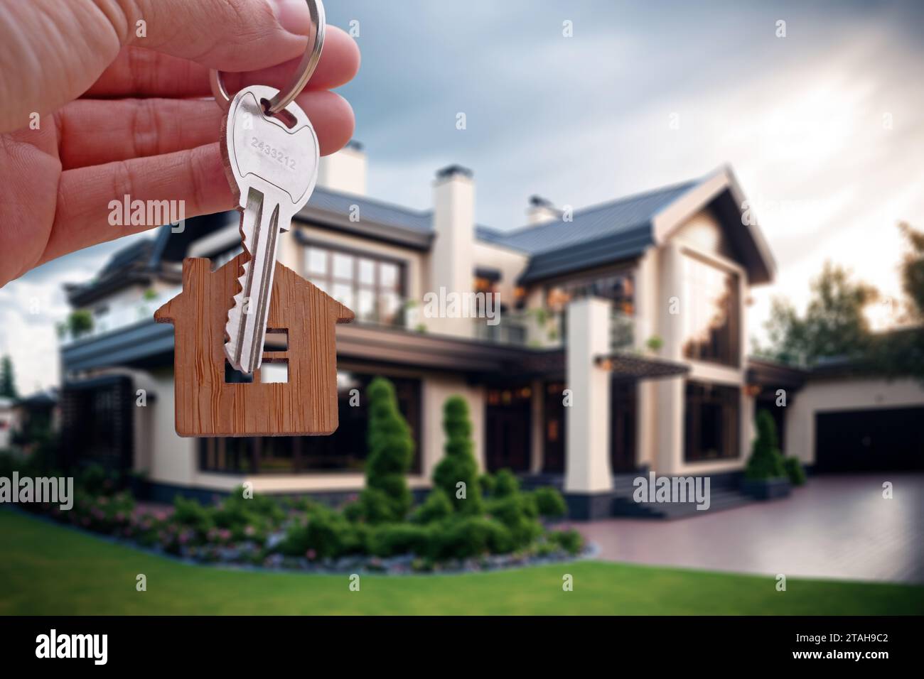 A man holding the key to his new house, real estate concept Stock Photo ...