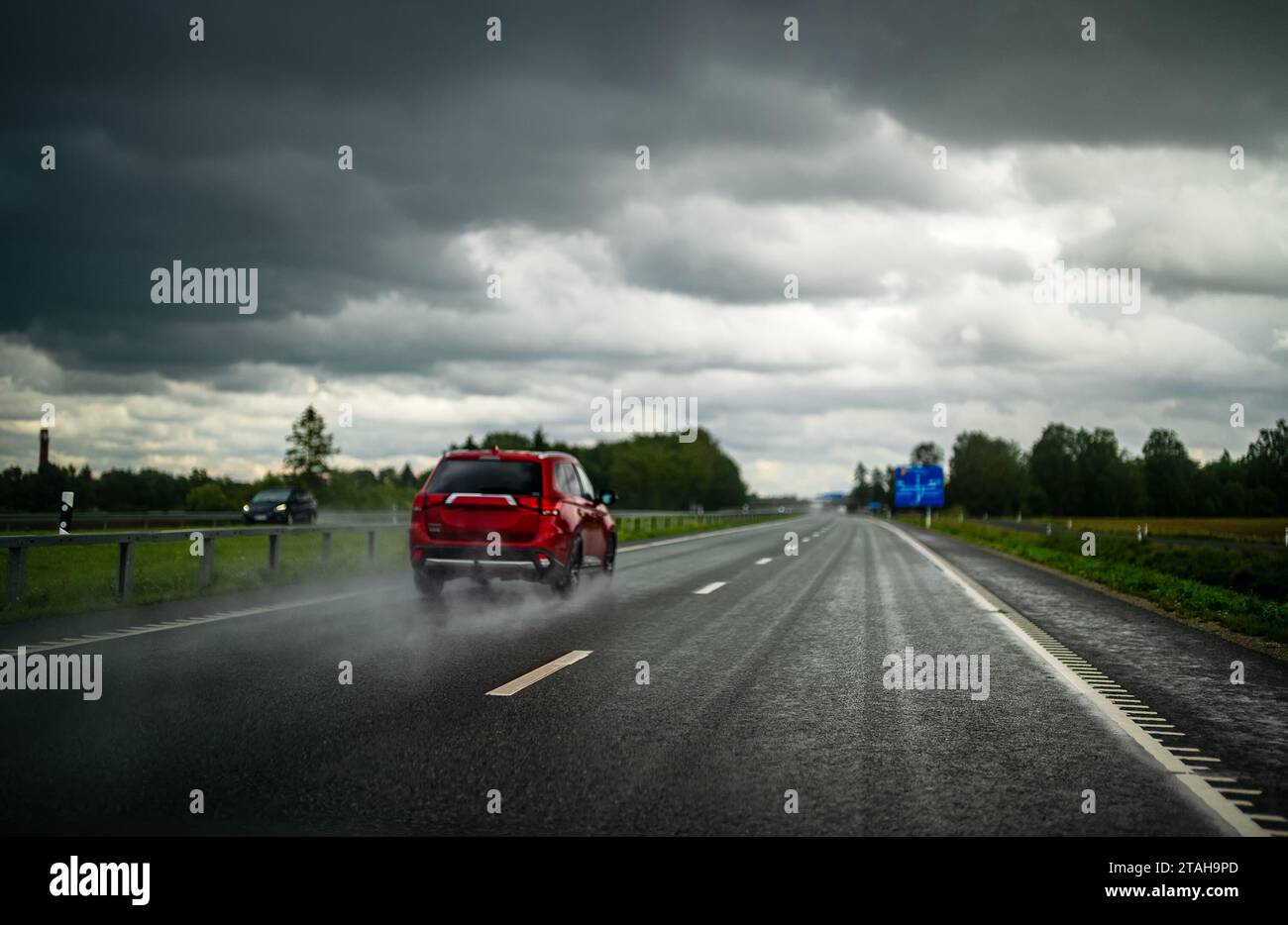 Bad road conditions. Rain and worsening weather Stock Photo - Alamy
