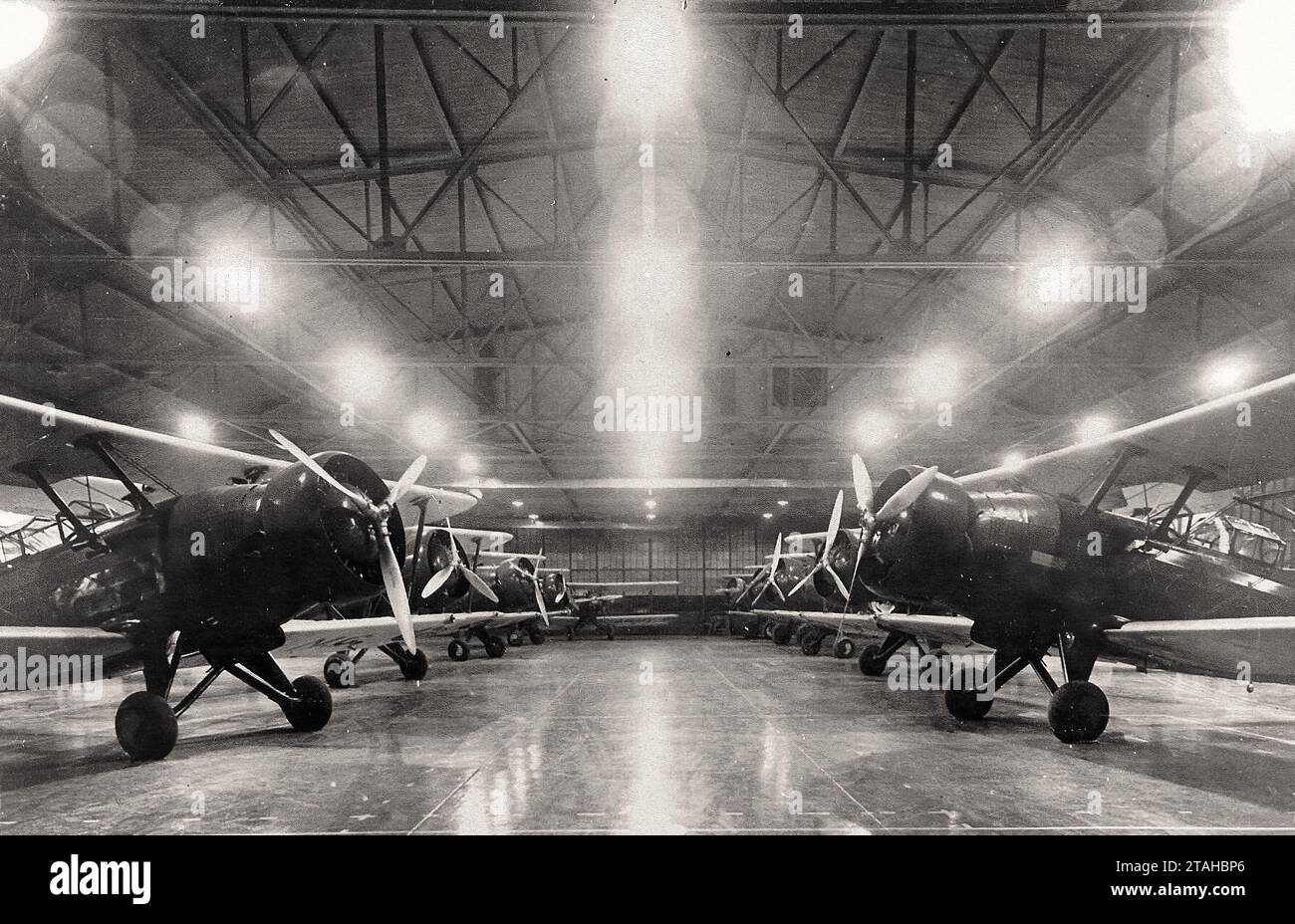 Airplane - Douglas O-38s (MO ANG) lined up inside hangar in 1930s ...