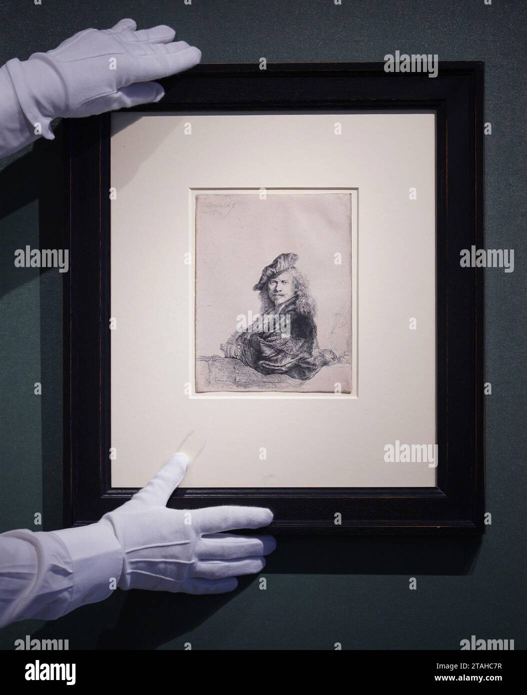 An etching by Rembrandt van Rijn, Self-Portrait leaning on a Stone Sill ...