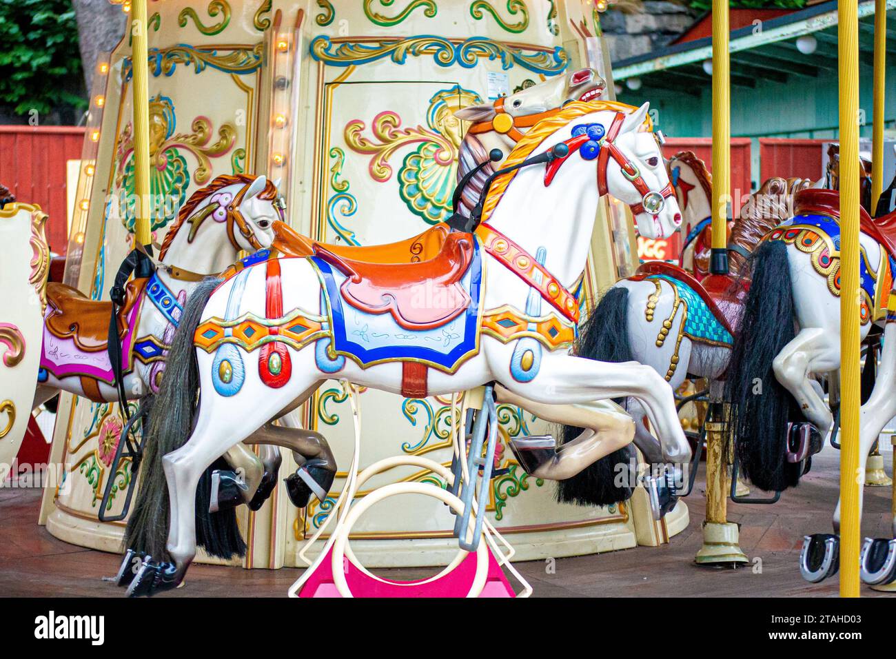A vintage carousel horse in a city amusement park Stock Photo - Alamy