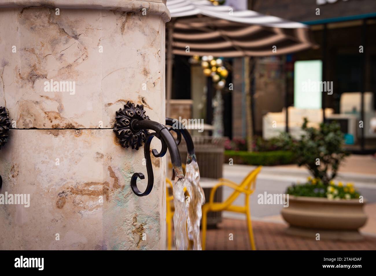 Outdoor Fountain with Seating and Umbrella in Background Stock Photo ...