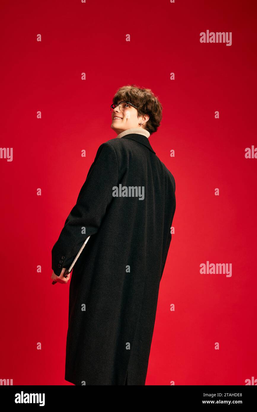 Young executive. Back view of modern officially dressed young man ...