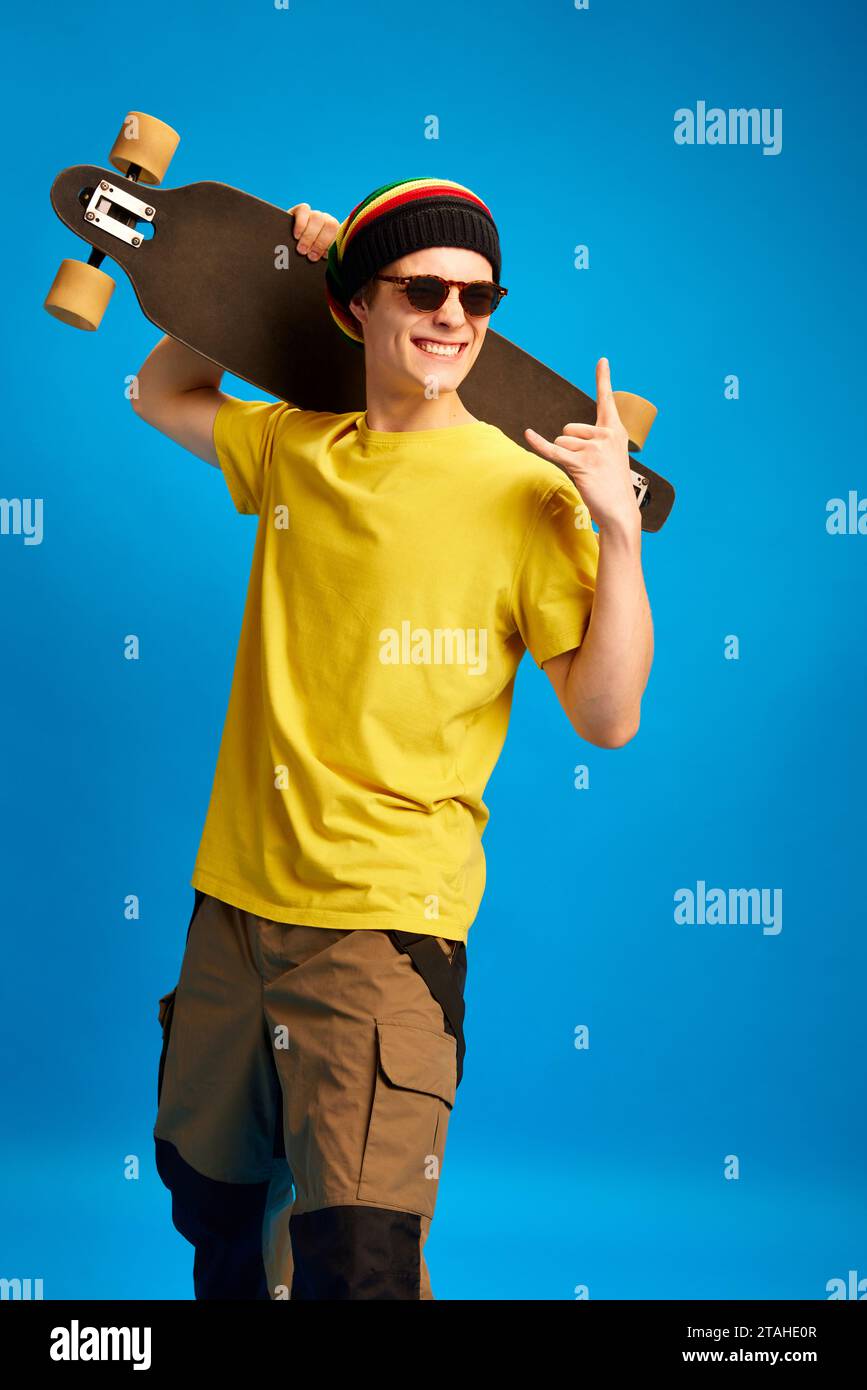 Portrait of cool guy, dude dressed in reggae, rastaman style and posing ...