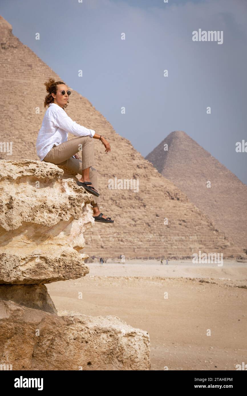 One man sitted, looking at the Pyramids of Gyza, Egypt Stock Photo - Alamy