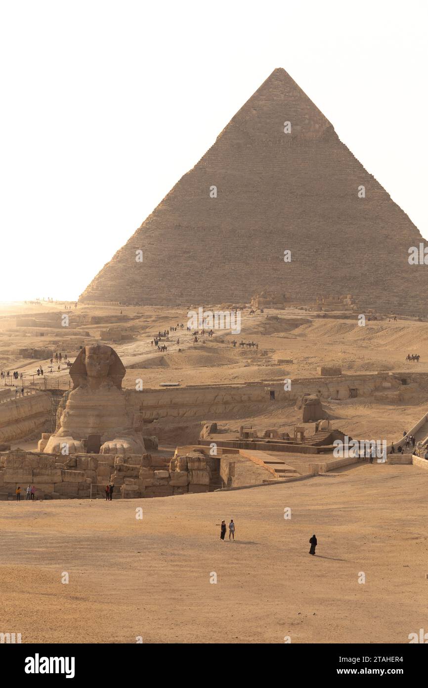 Tourists walking around the Great Sphinx of Gyza and Pyramids Stock ...