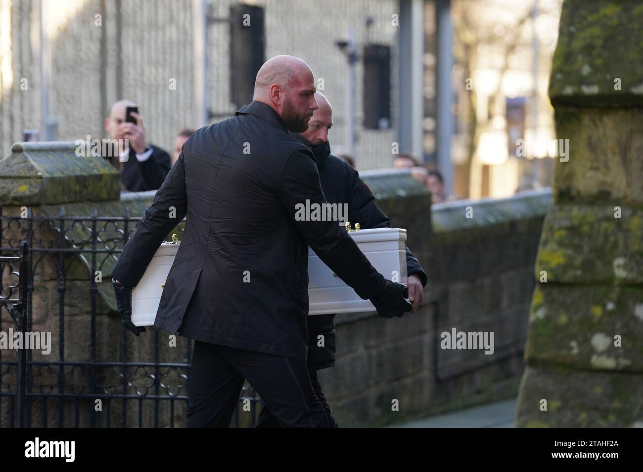 The father of Indi Gregory, Dean Gregory (front) carries the casket of ...