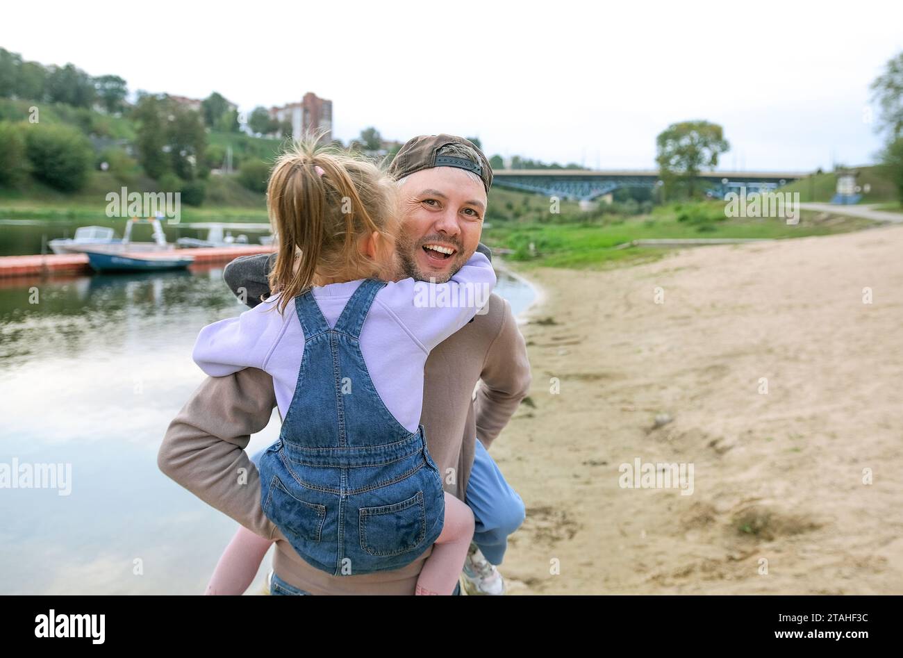 Close-up of a man carrying his children on his back outdoors Stock ...