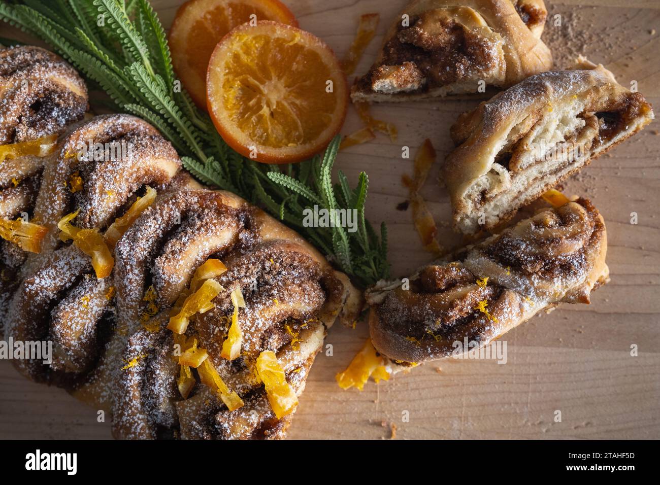 Overhead view of sliced cardamom bread with candied oranges Stock Photo ...