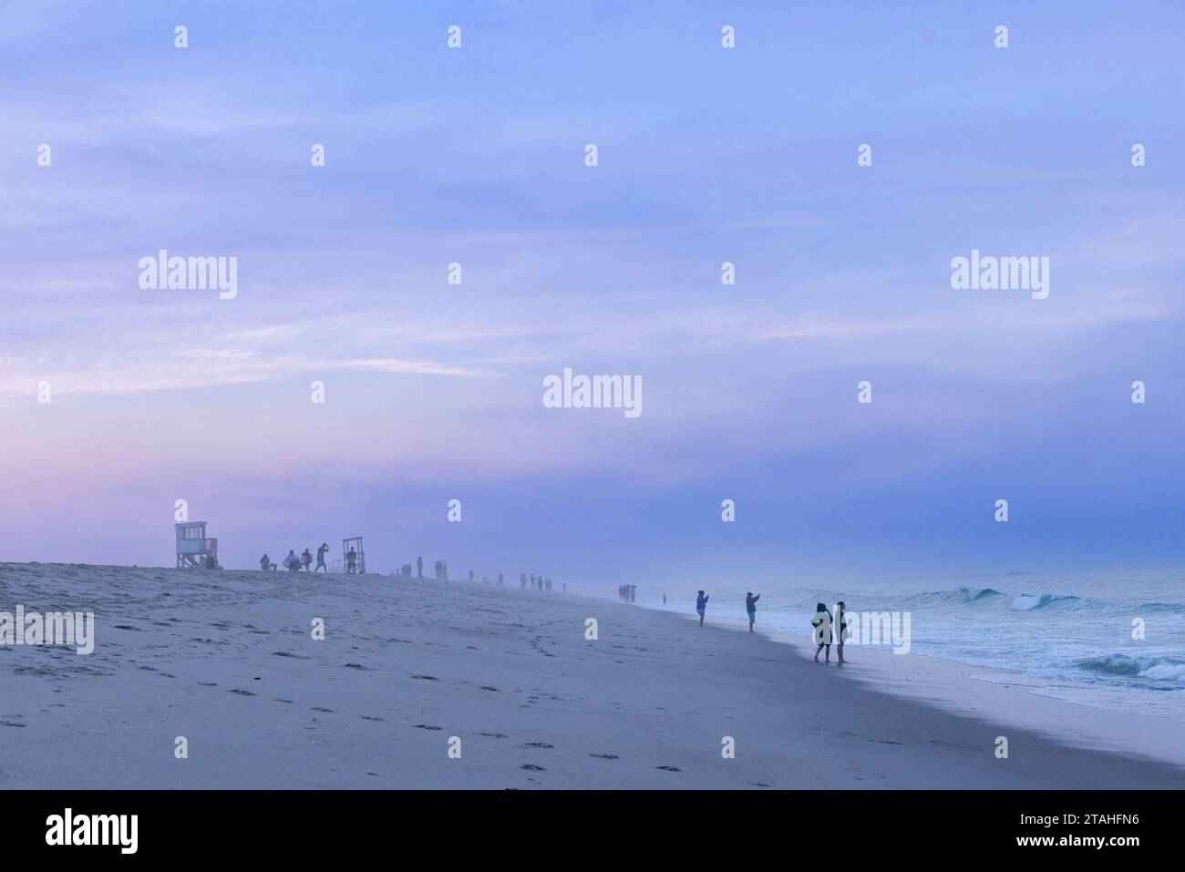 Silhouetted people at Nauset Beach on Cape Cod at Sunset Stock Photo ...