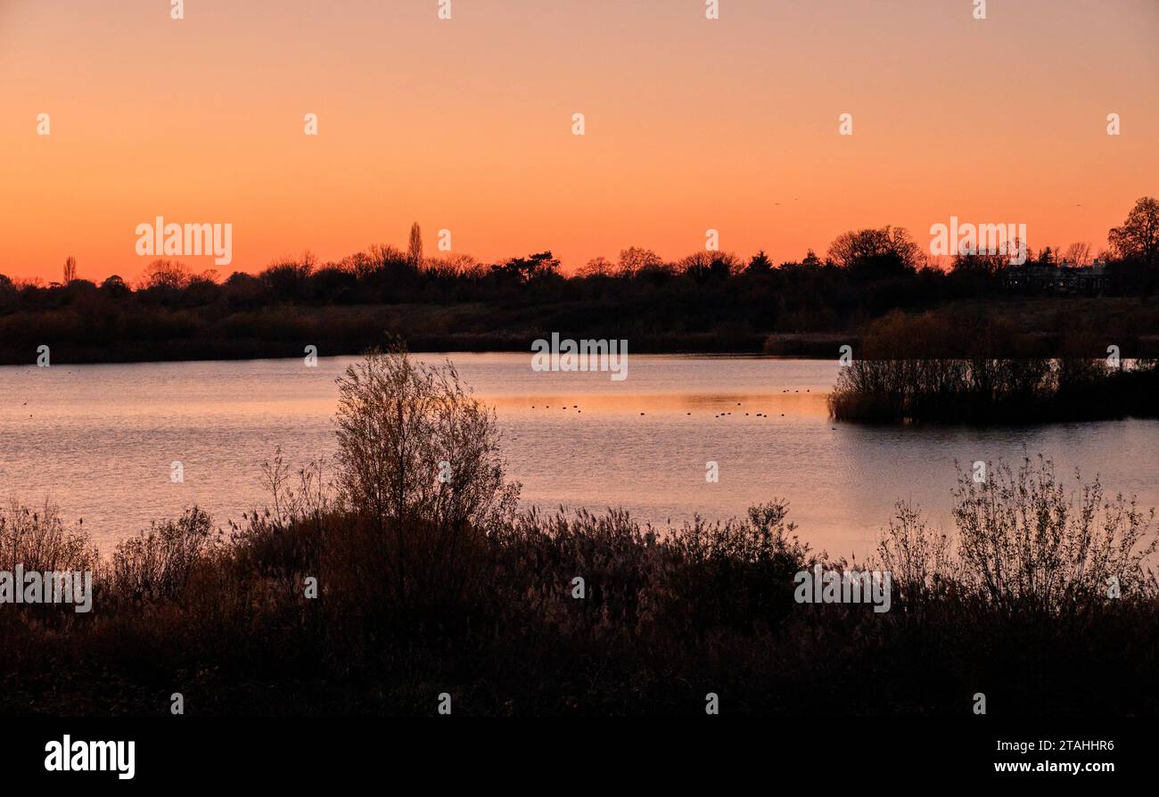 Sunset over over the former Lambeth Reservoir of Molesey Reservoirs ...