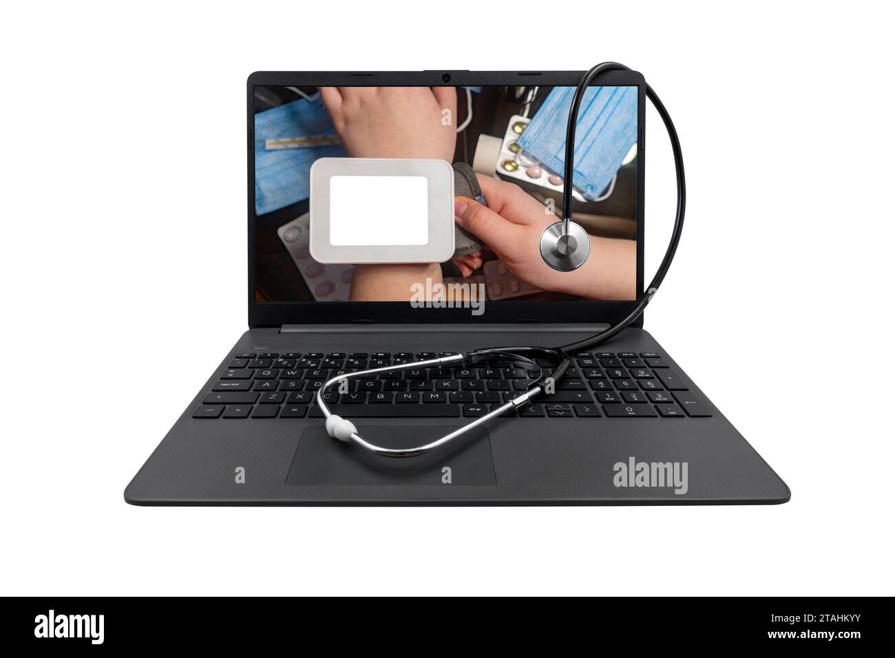 Laptop and medical stethoscope on white background. On the laptop ...