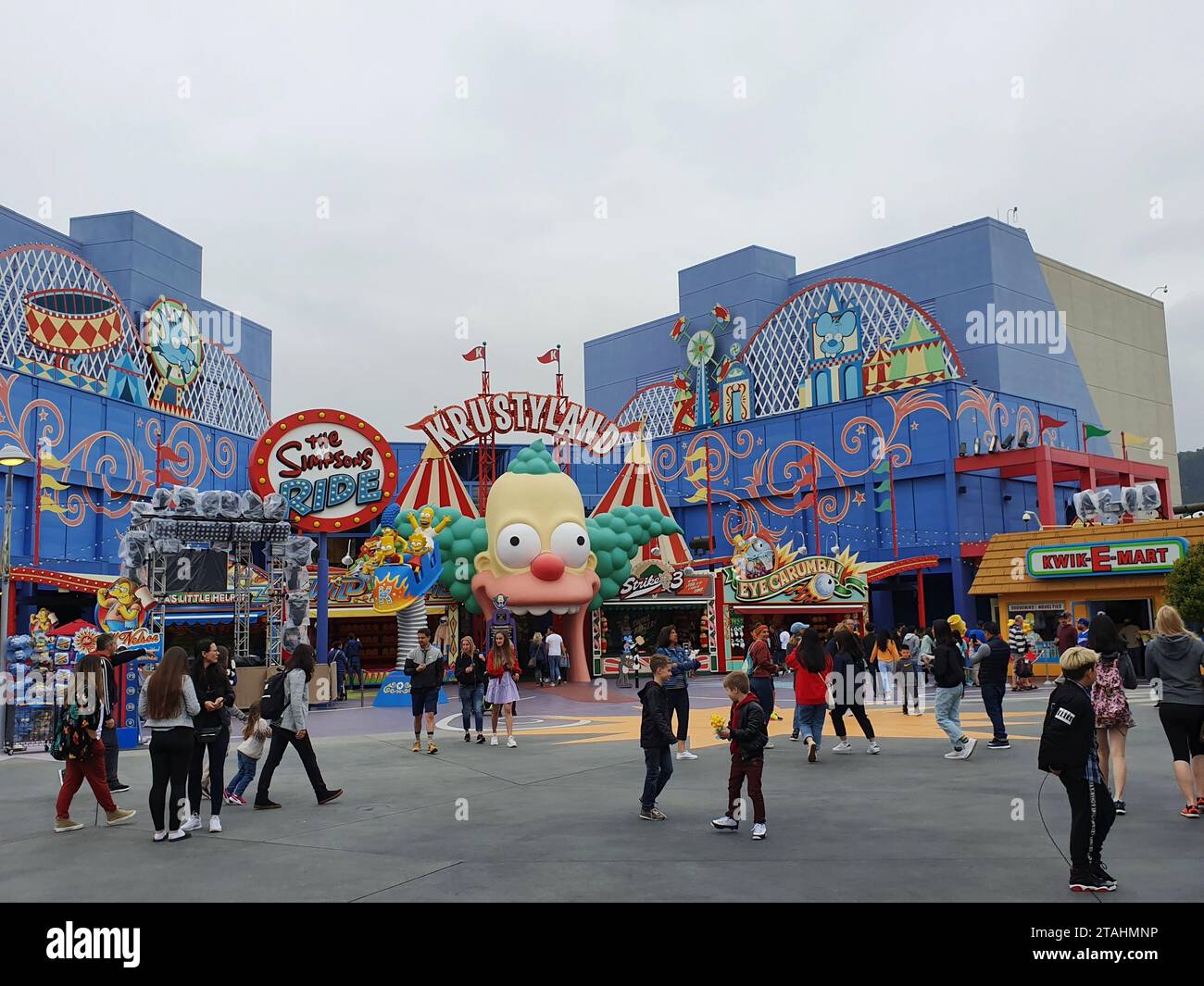 A lively crowd of people strolling in Krustyland. Universal Studios ...