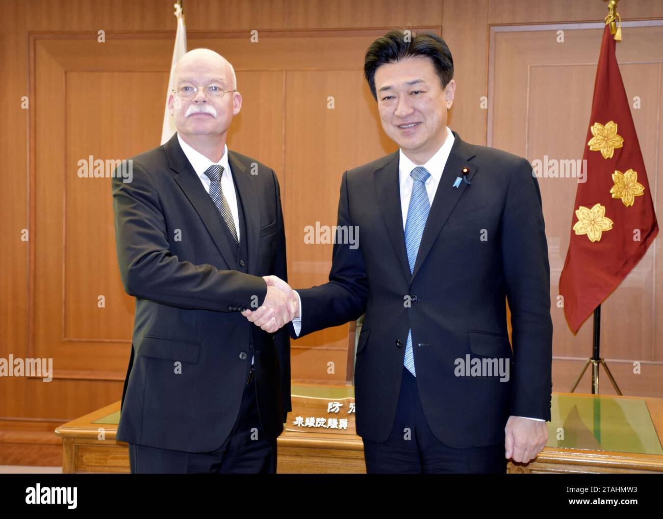 Japanese Defense Minister Minoru Kihara (R) and German Ambassador to ...